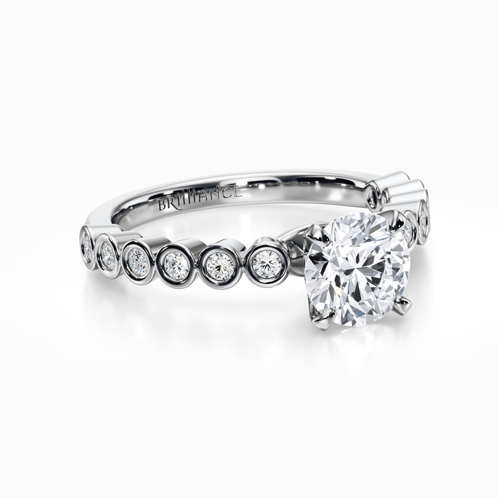 Modern Unique Bezel Set Engagement Ring In Platinum
