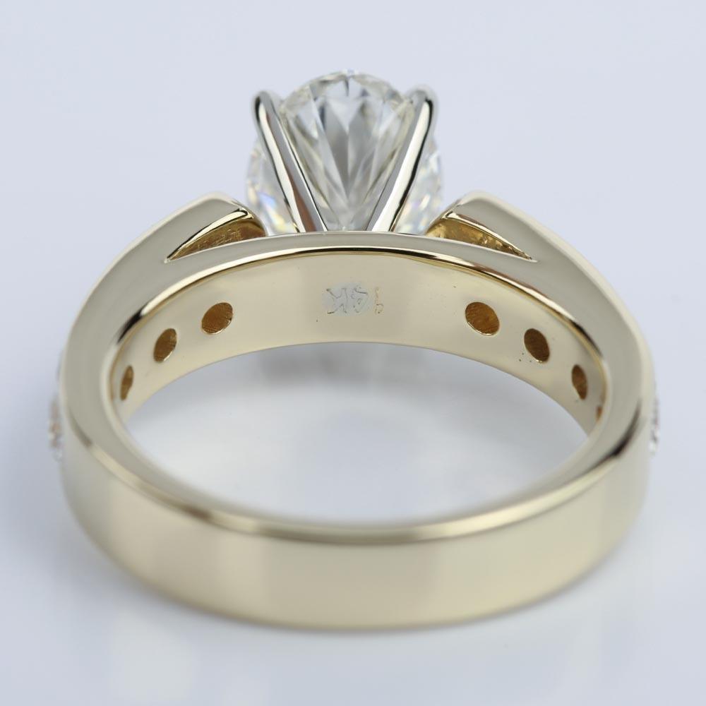 Oval Channel Set Diamond Engagement Ring In Yellow Gold